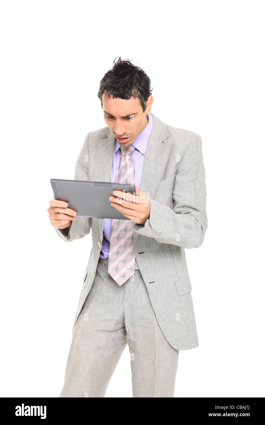 young business man standing using a tablet isolated on white background ...