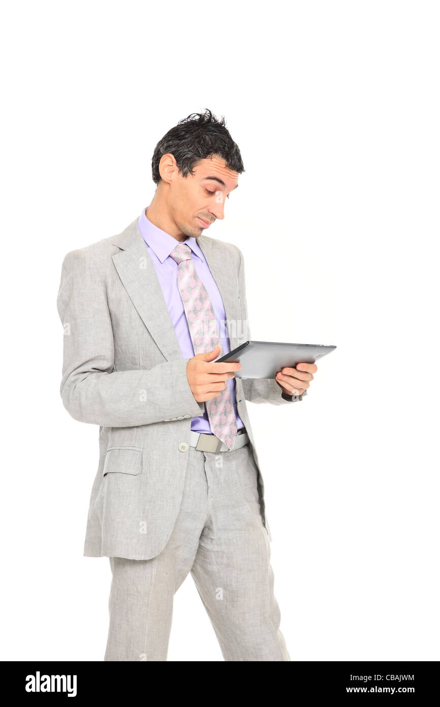 young business man standing using a tablet isolated on white background ...