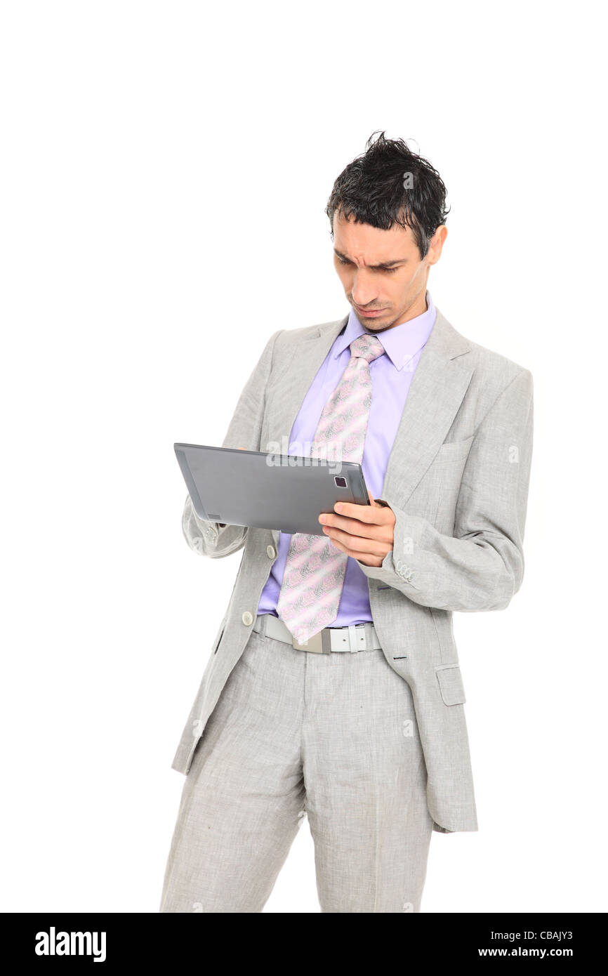 young business man standing using a tablet isolated on white background ...