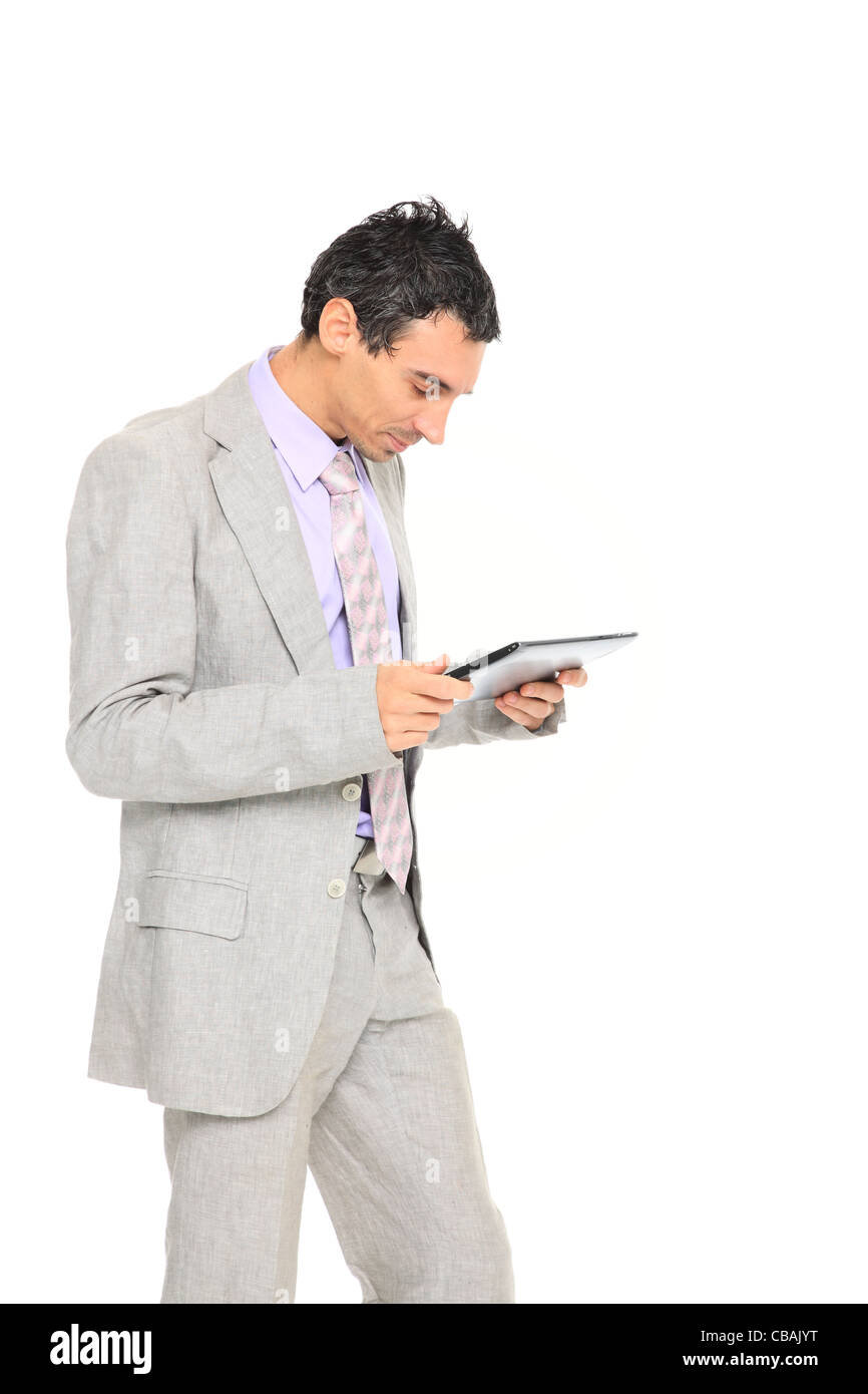 young business man standing using a tablet isolated on white background ...