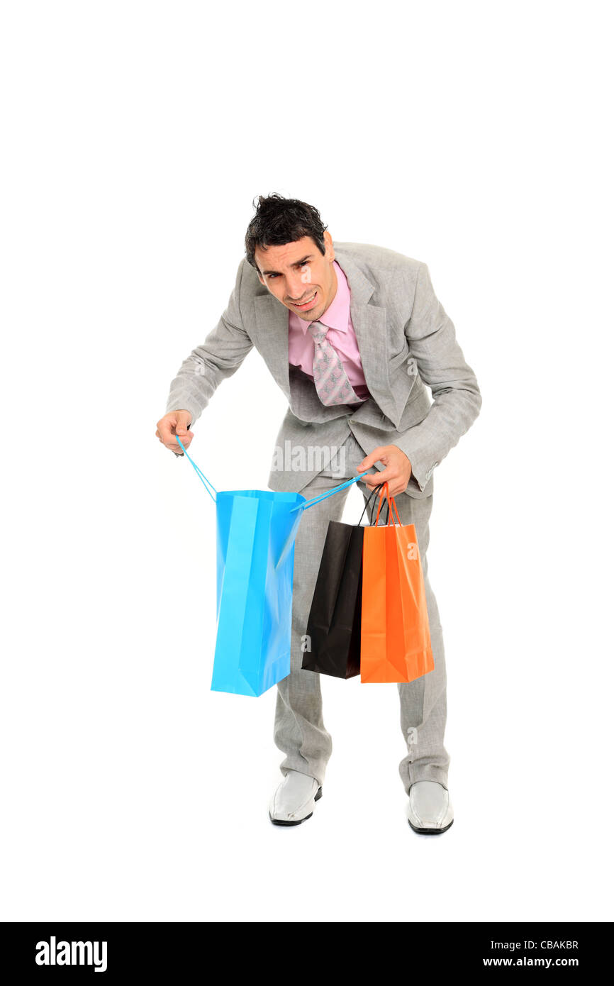 Happy shopping man. Isolated over white background Stock Photo - Alamy
