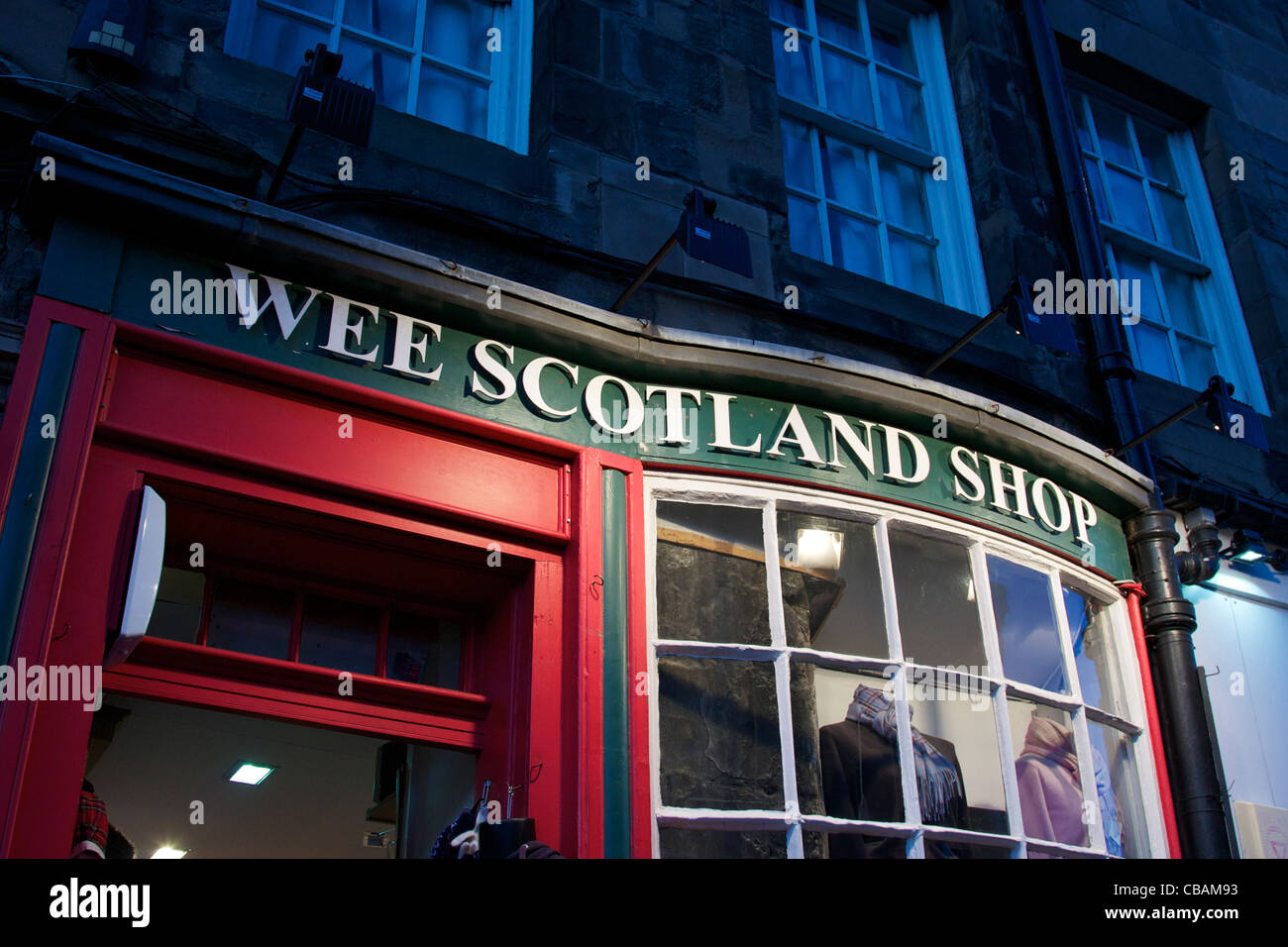 Illuminated shop front at night on the Royal Mile, Edinburgh Stock ...