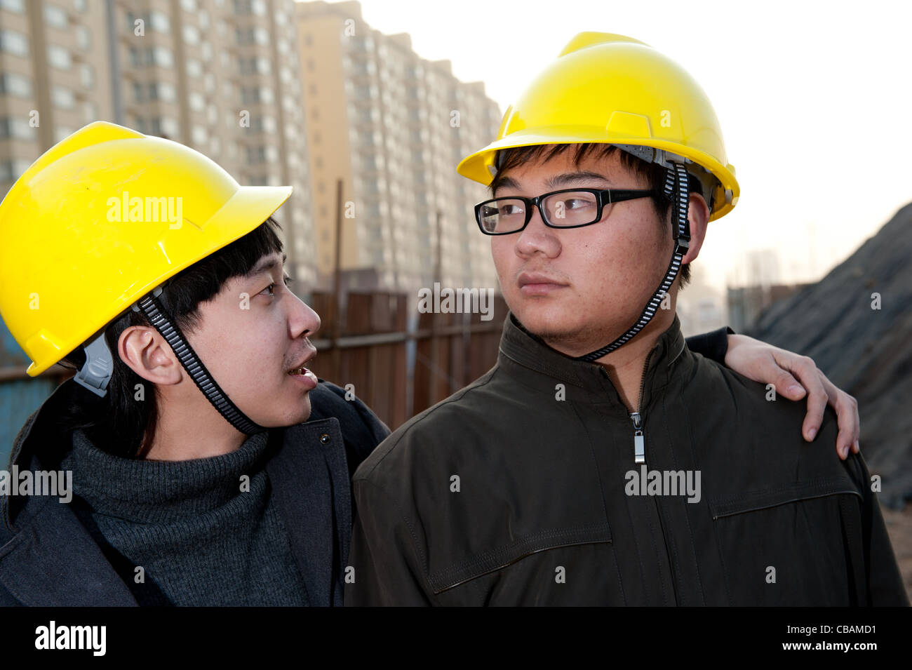 Construction workers chatting Stock Photo - Alamy