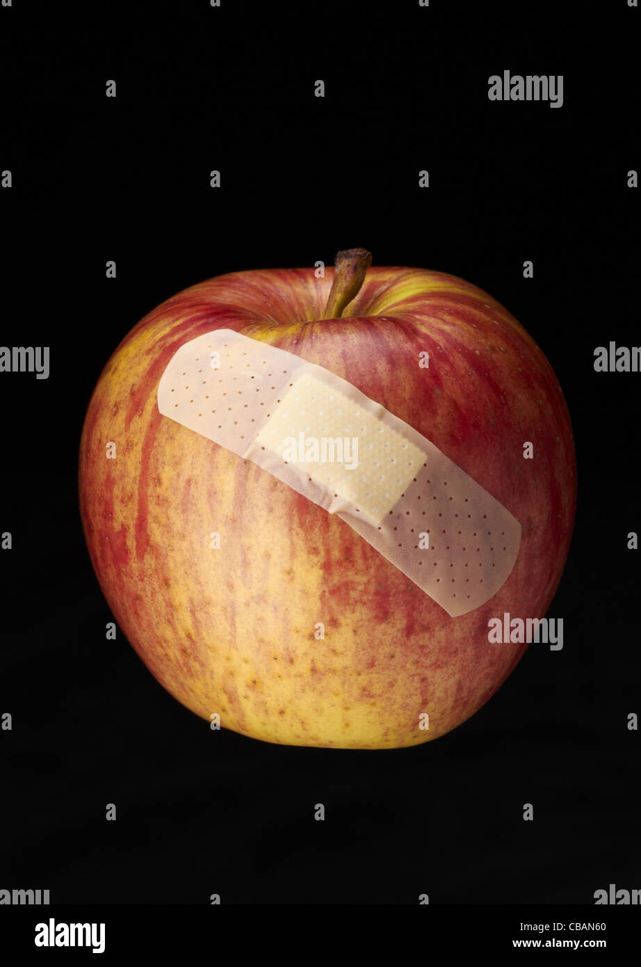 Apple with band-aid Stock Photo - Alamy