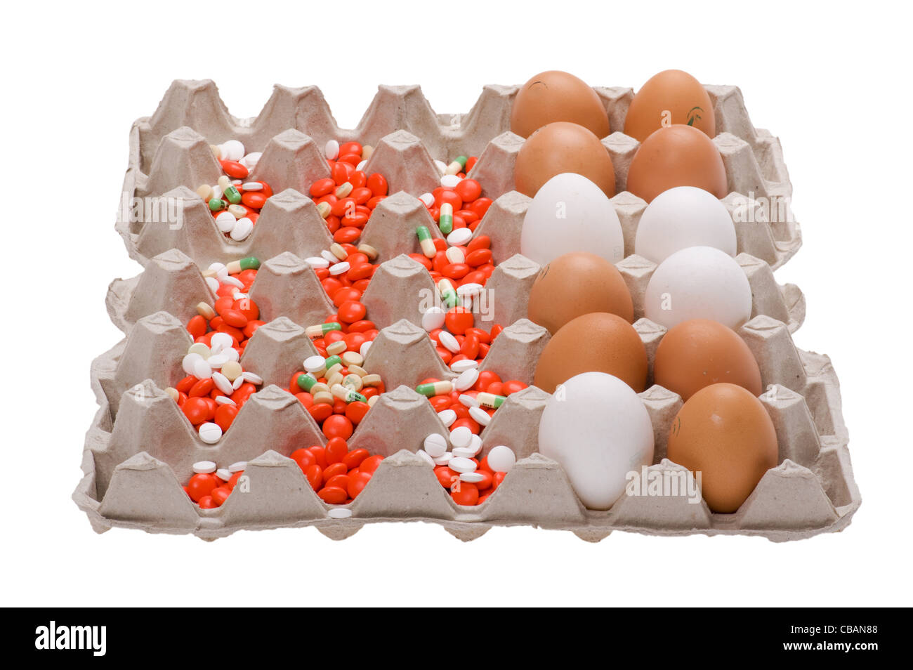 object on white - egg and medical tablet on box Stock Photo - Alamy