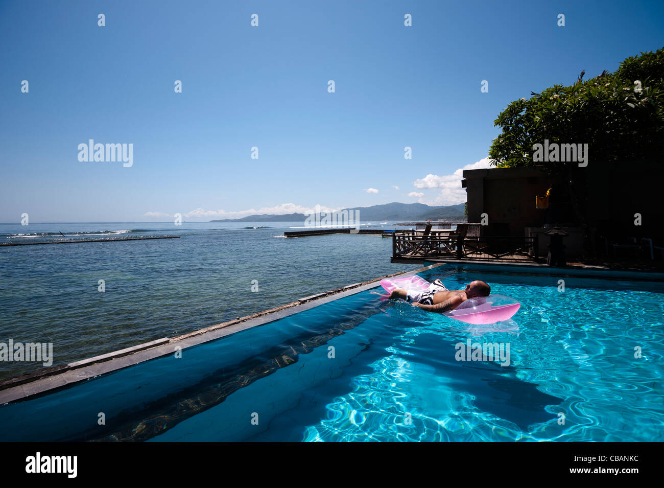 Relaxing in a swimming pool on Bali Island, Indonesia Stock Photo - Alamy