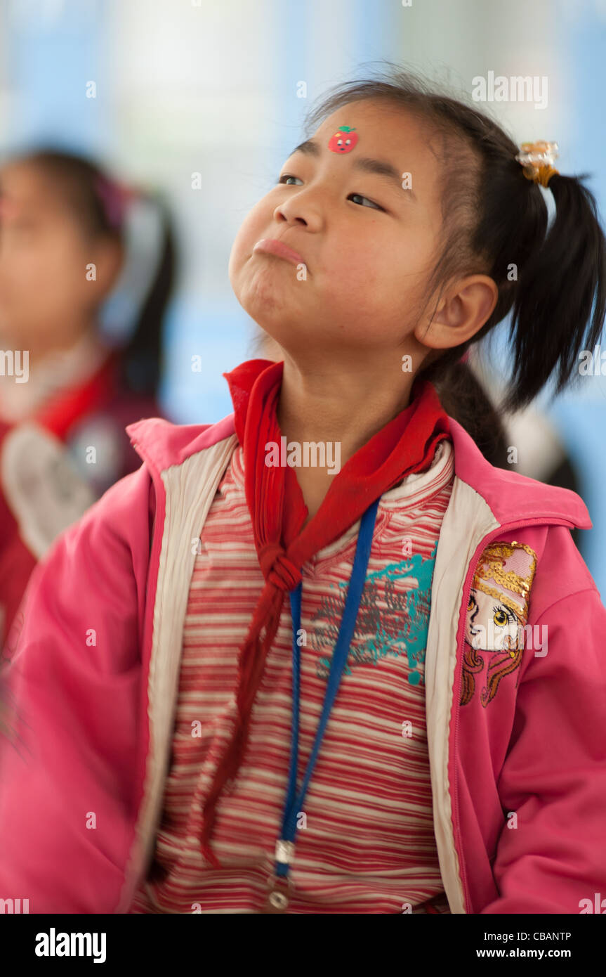 A child attends class in the primary school, Huaxi Village, Jiangsu ...