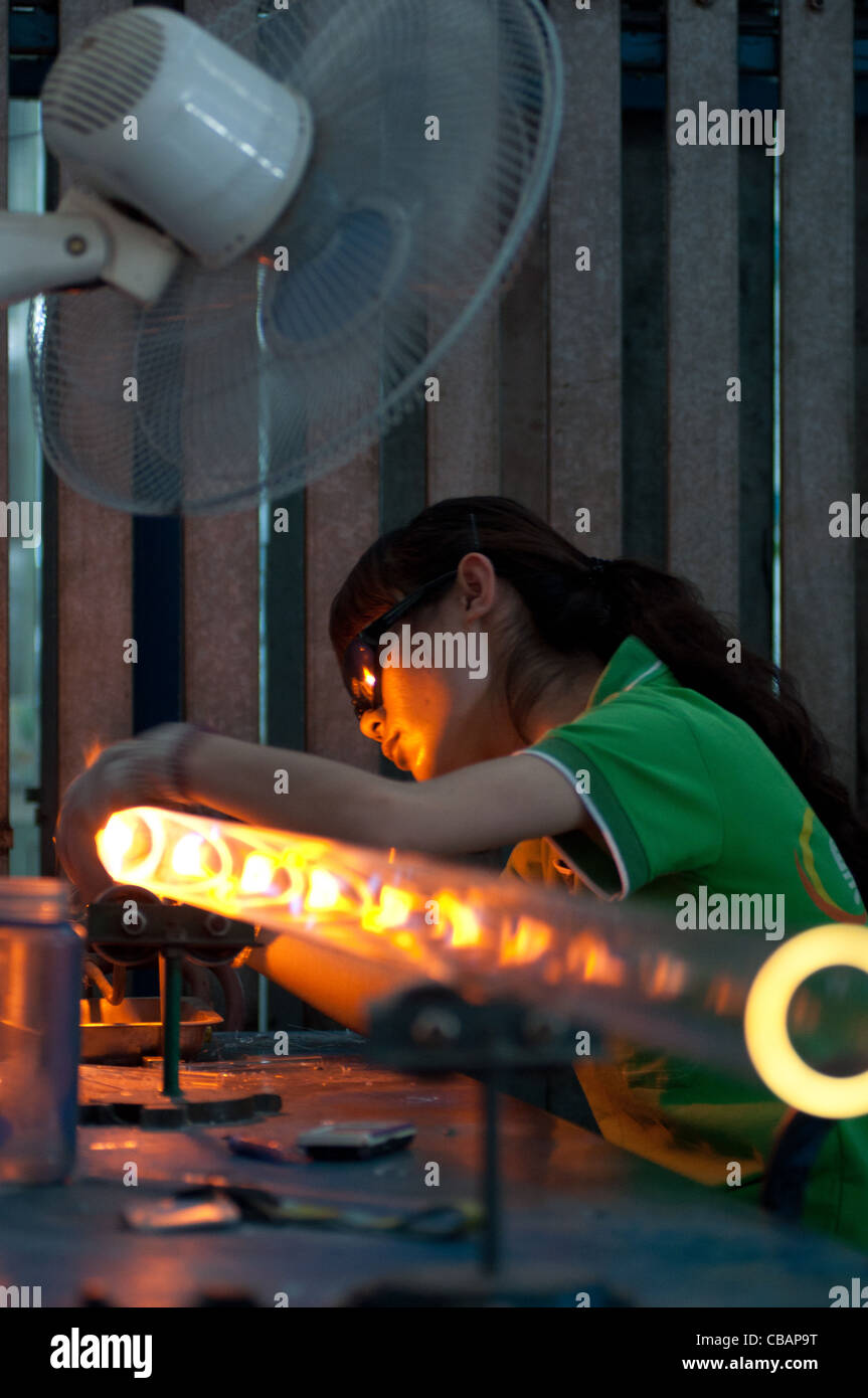 A worker in the Himin Solar Corporation, a Chinese factory leader in ...
