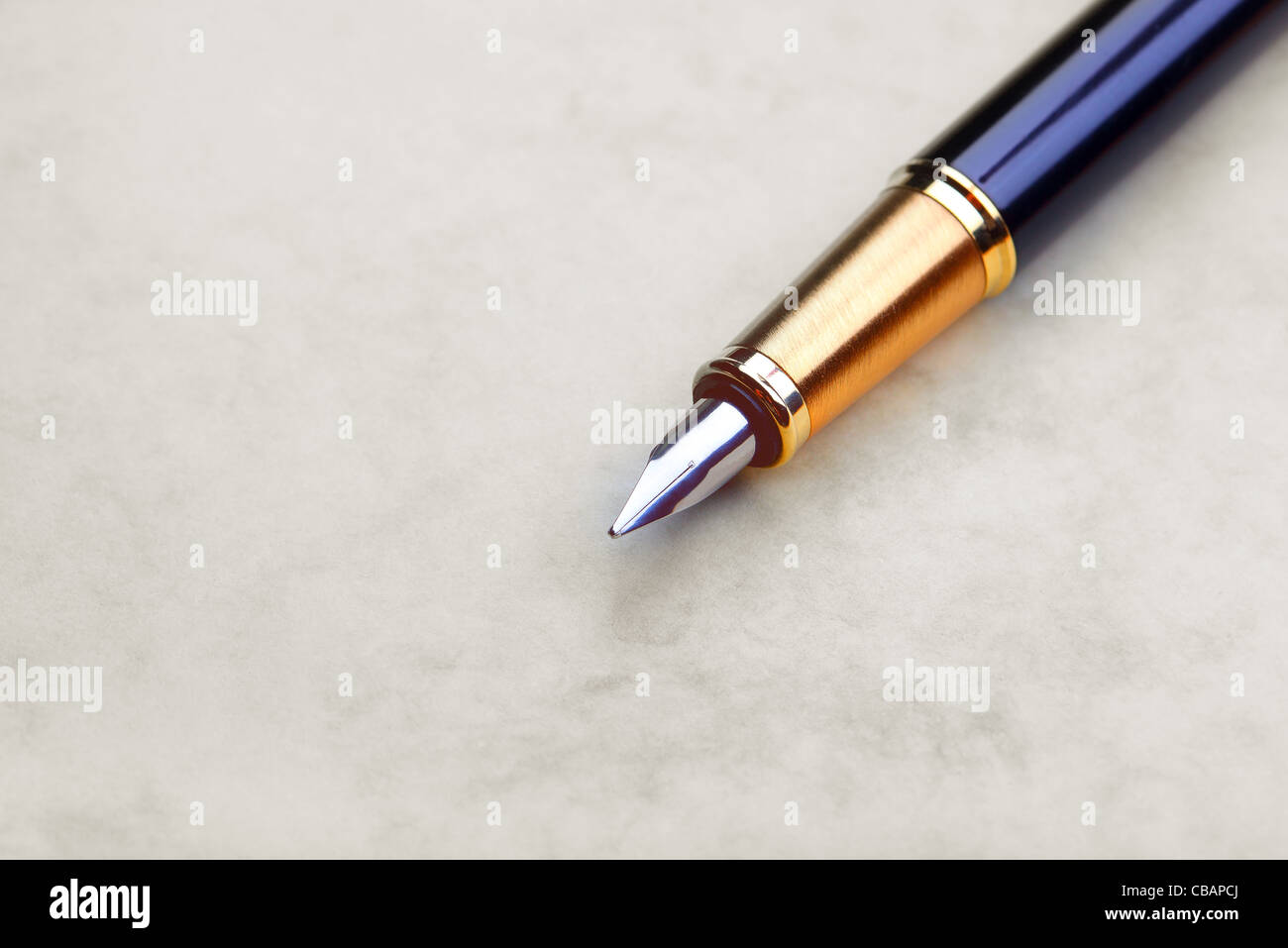 Ink pen on old aged paper Stock Photo - Alamy