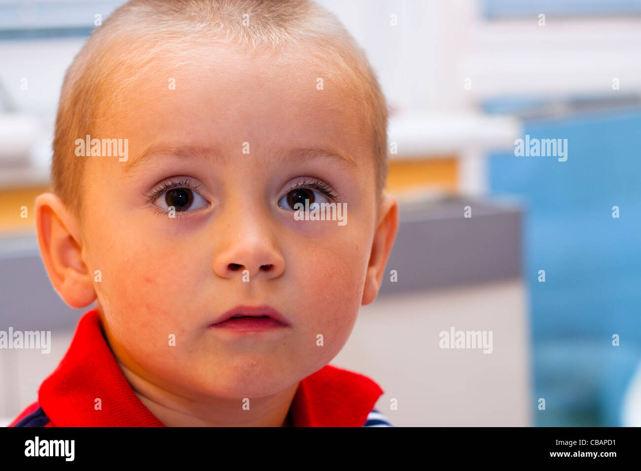 Portrait of serious child face indoors Stock Photo - Alamy