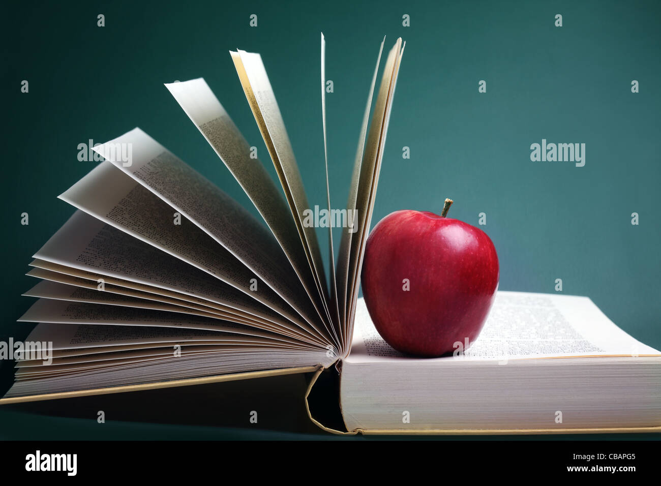 Books and apple Stock Photo - Alamy