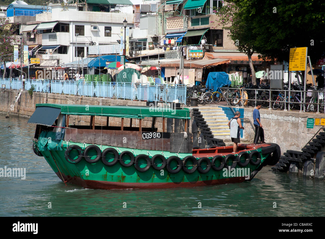 A Wooden Sampan sailing into the harbour of Cheung Chau Hong Kong SAR ...
