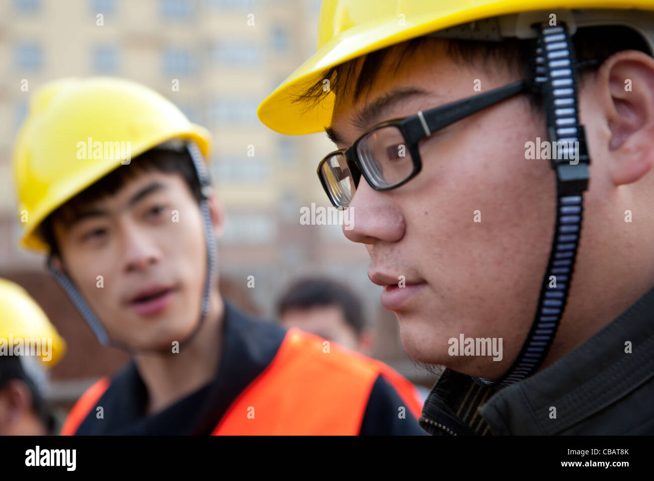 Construction workers chatting Stock Photo - Alamy