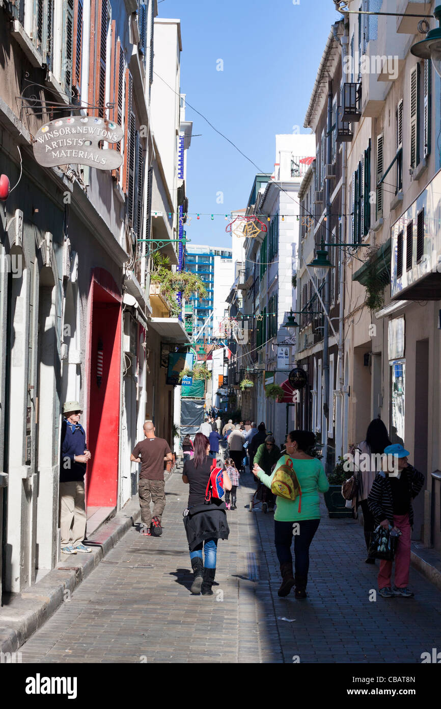 Walking people, buildings and Christmas decorations. Irish Town ...