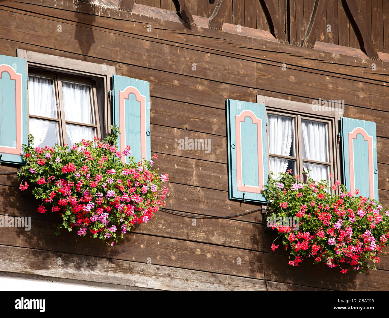 Old house with flowers on the window Stock Photo - Alamy
