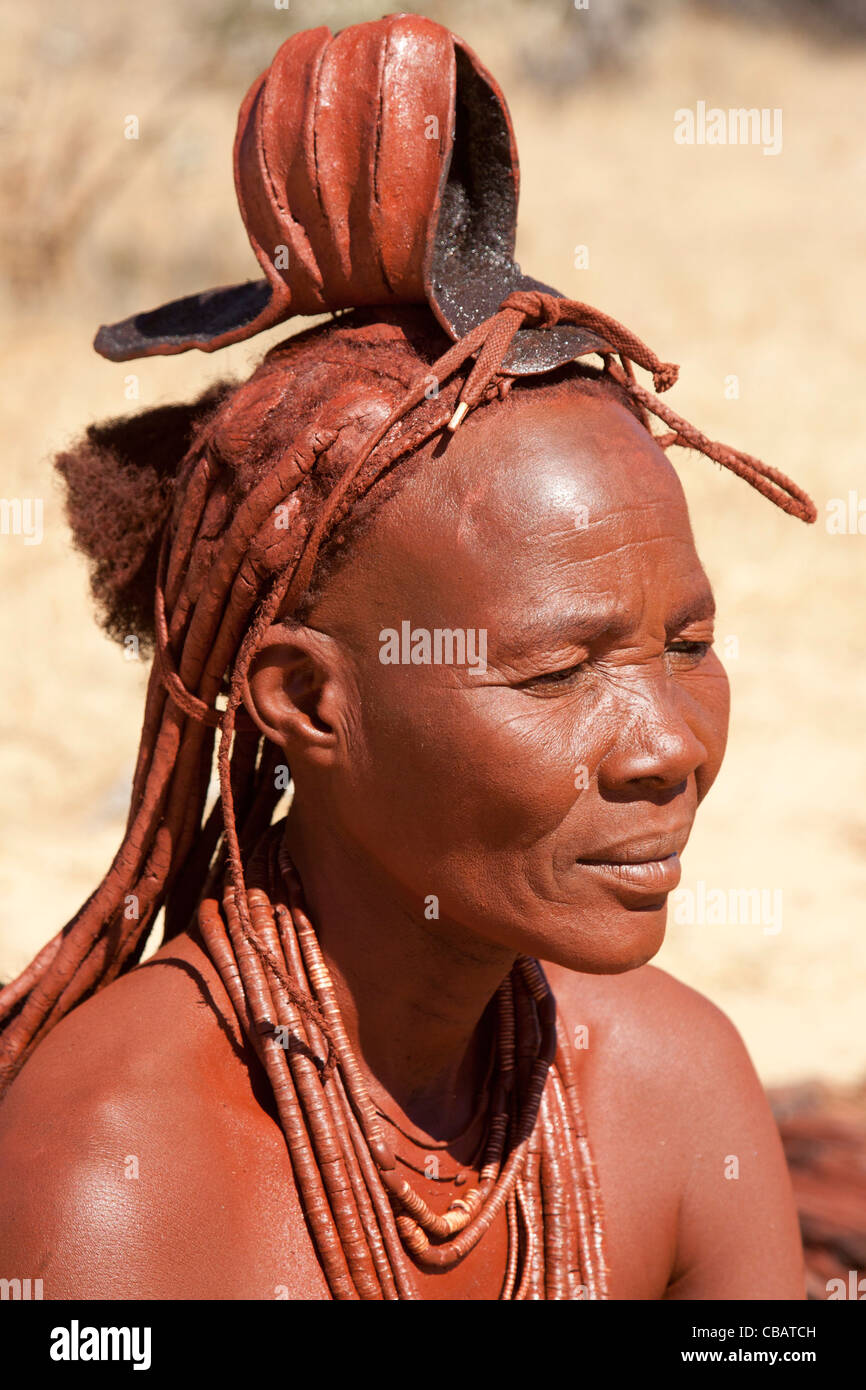 Africa, Namibia. Portrait of a nomadic Himba woman wearing the ...