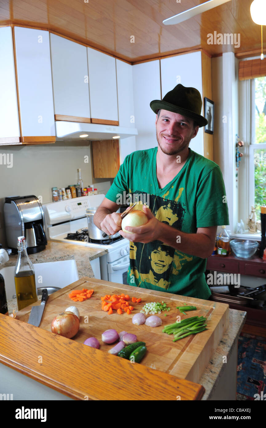 Celebrity chef, Spike Mendelsohn cooking in his home kitchen in ...
