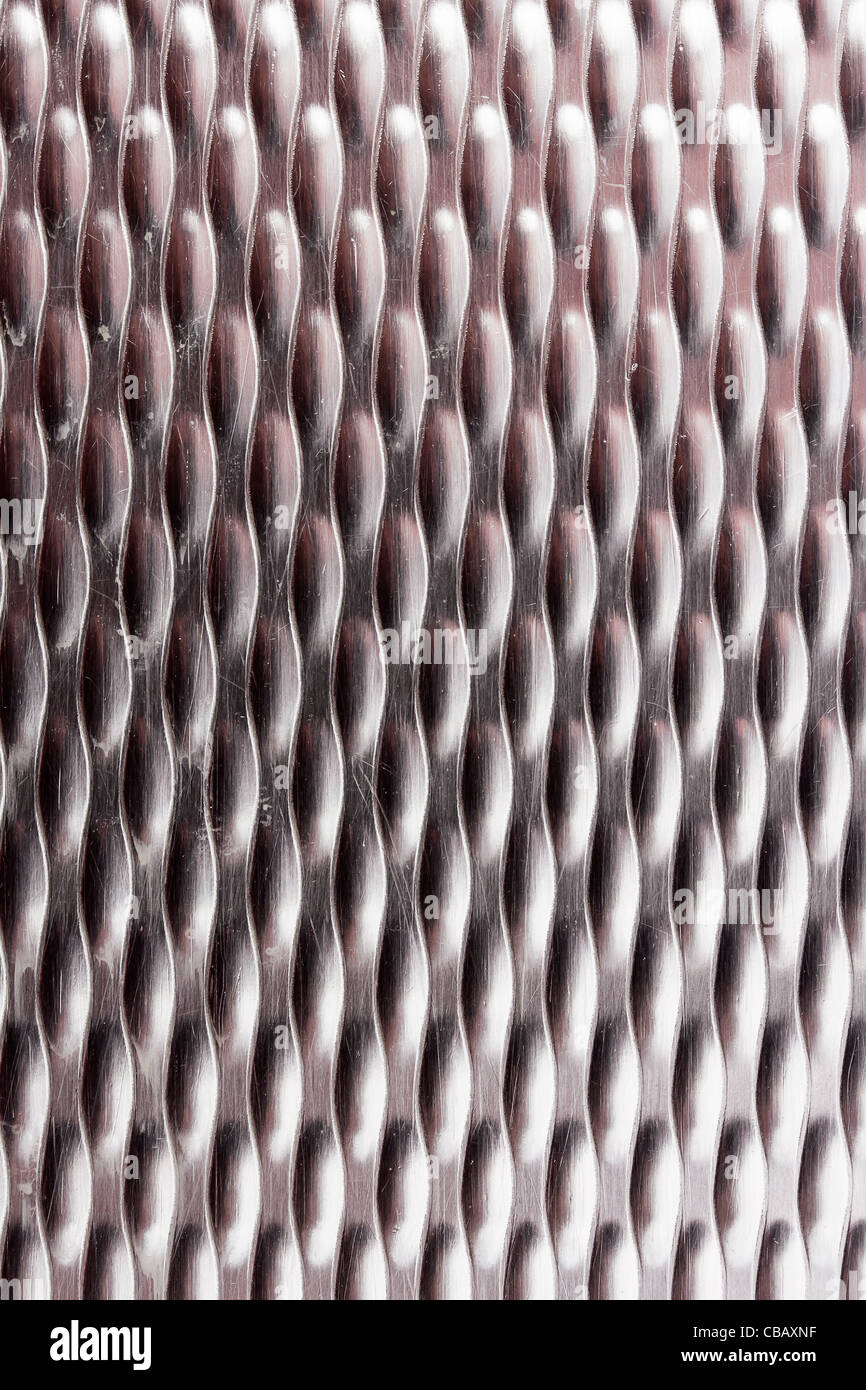 Dotted metal plate. Shiny steel Stock Photo - Alamy