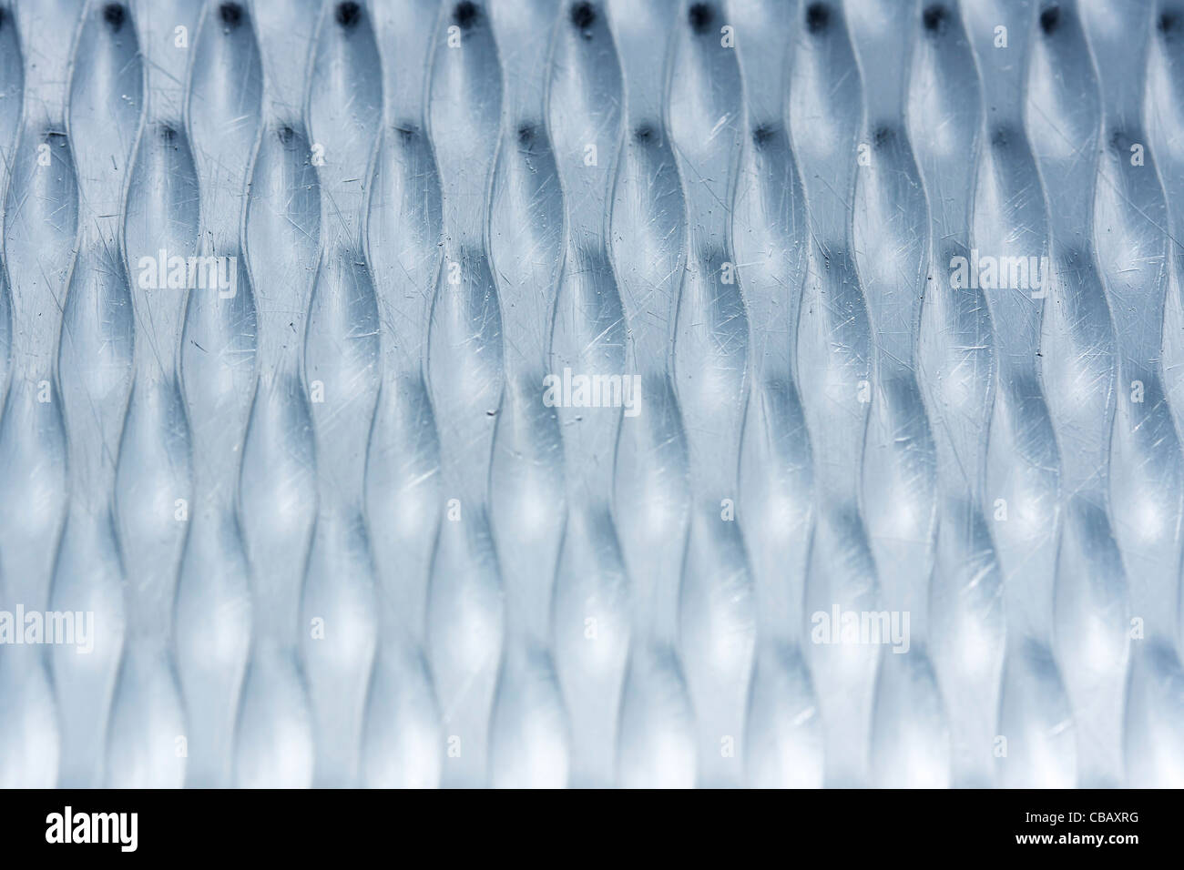 Dotted metal plate. Shiny steel Stock Photo - Alamy