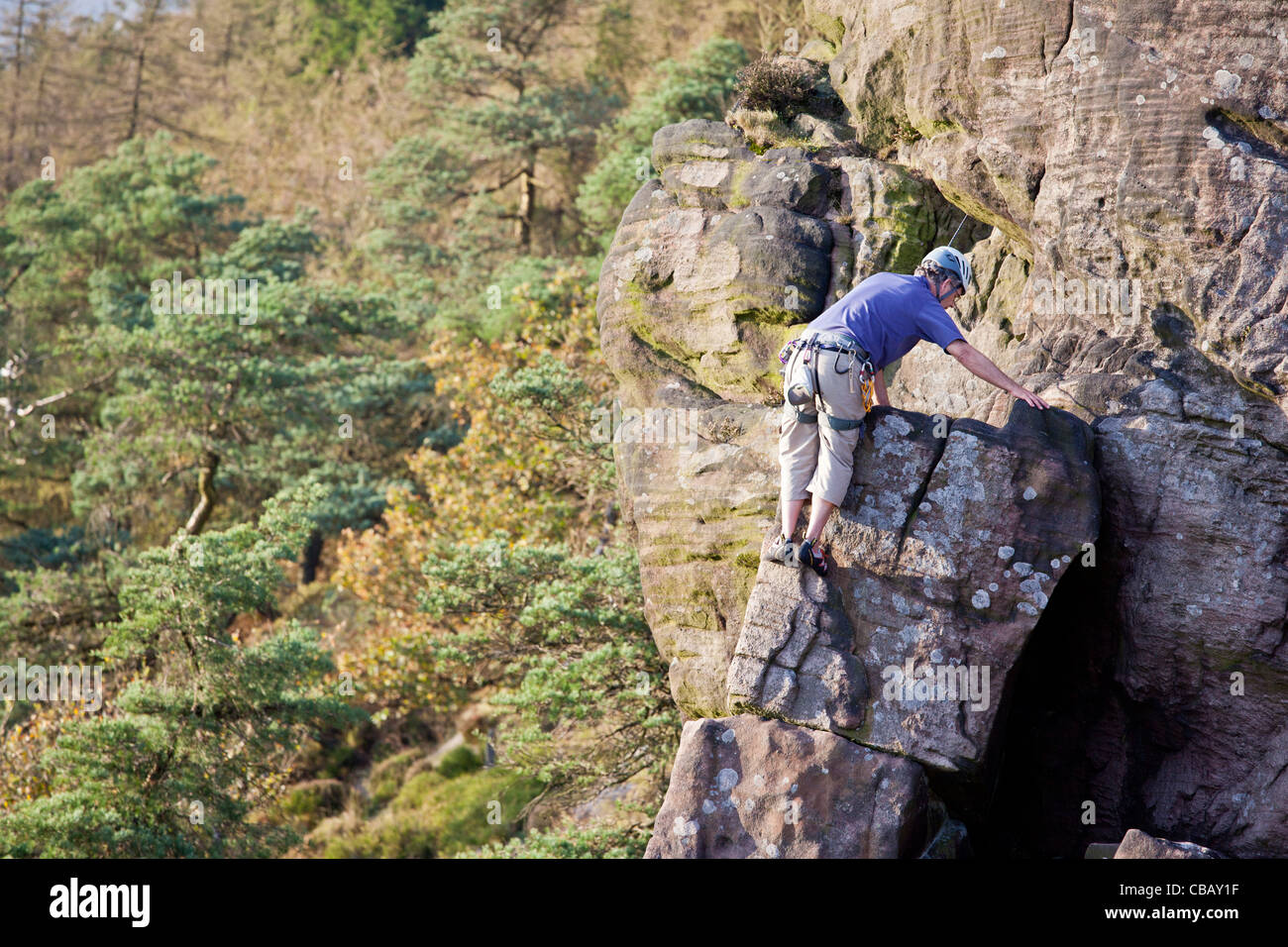 Rock Climber tackling The Gritstone Escarpment of The Roaches in The ...