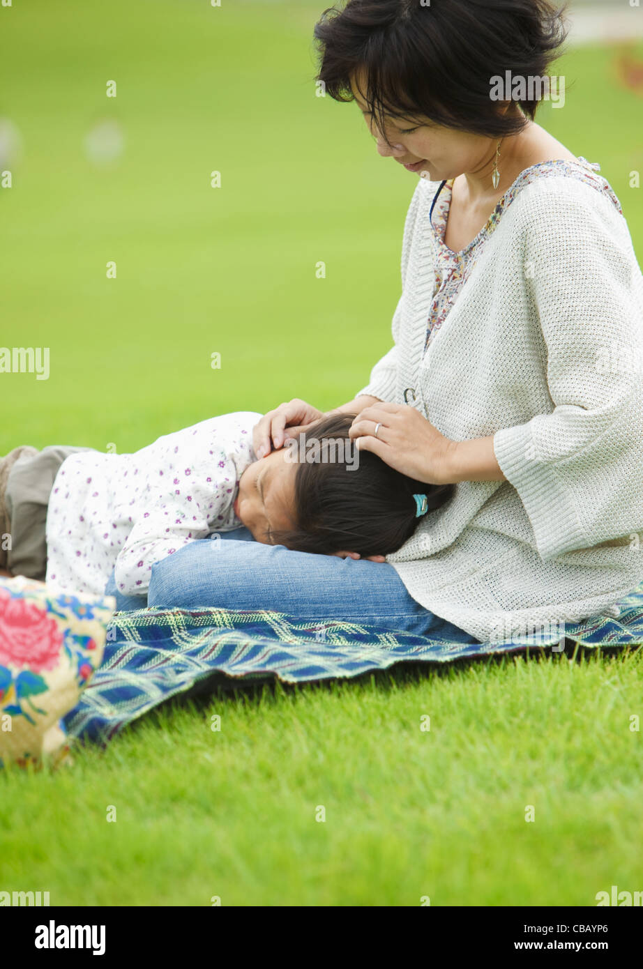 Girl sleeping in lap hi-res stock photography and images - Alamy
