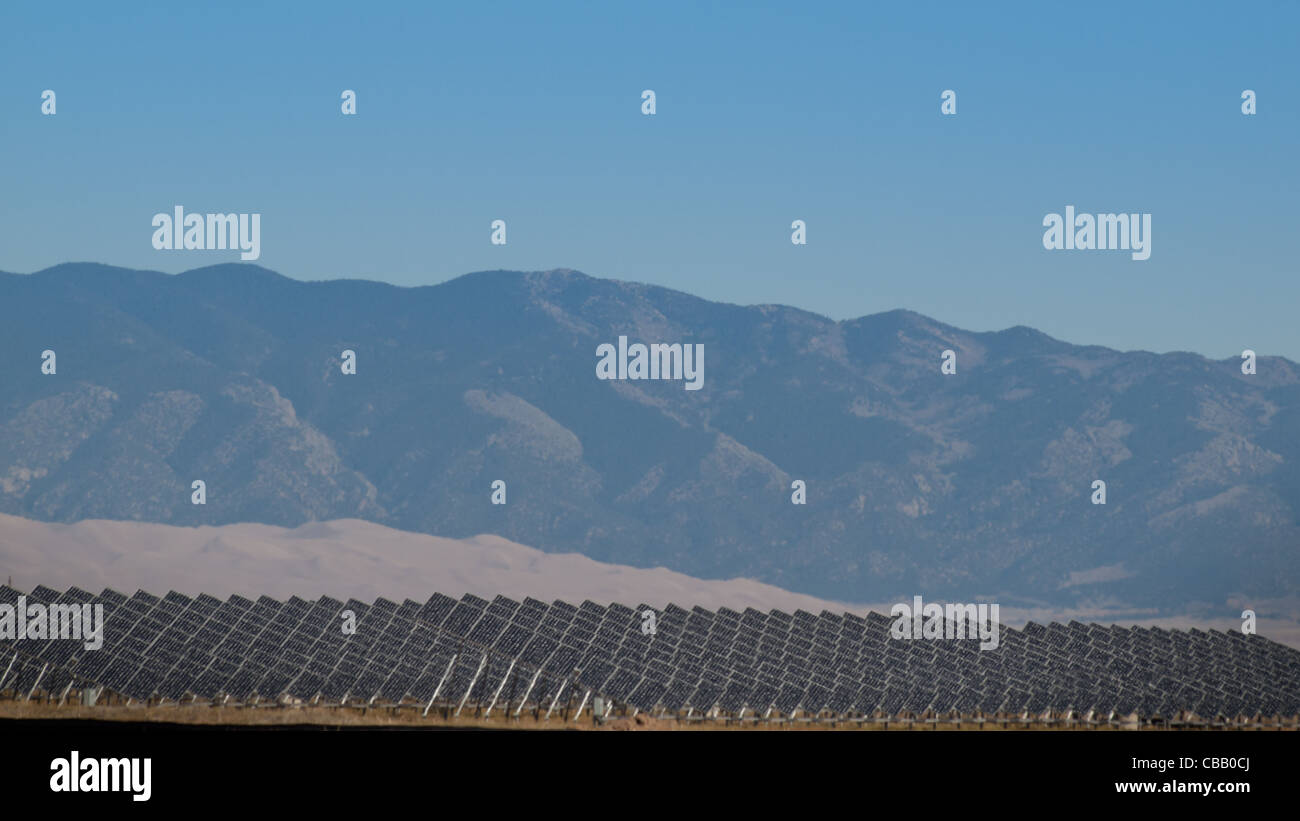 A series of large solar panels forms a symmetrical line at a power ...
