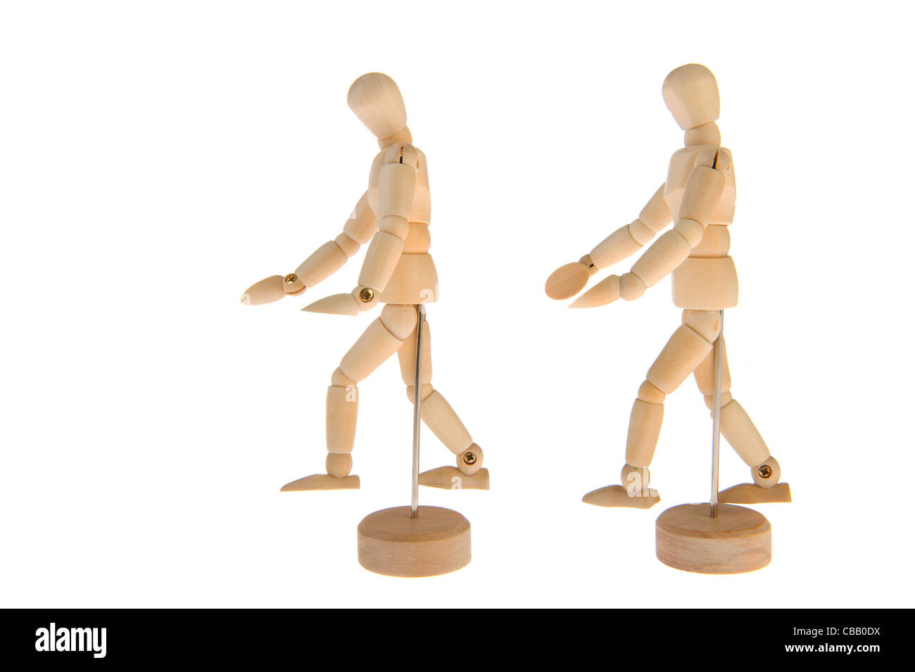 wooden model dolls walking or running on white background Stock Photo ...