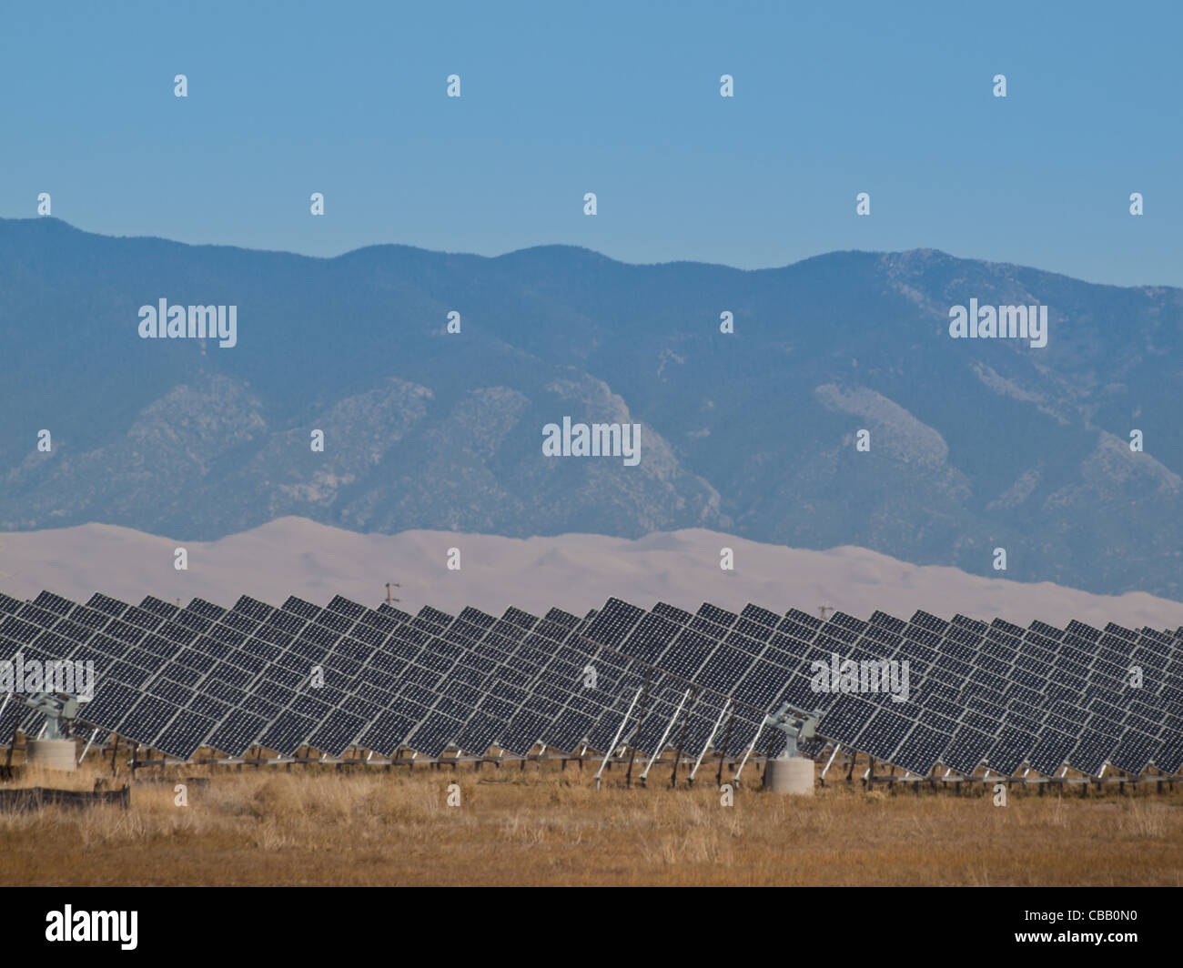 A series of large solar panels forms a symmetrical line at a power ...