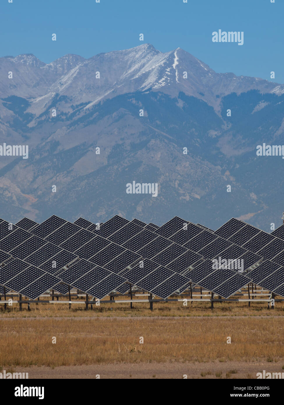 A series of large solar panels forms a symmetrical line at a power ...