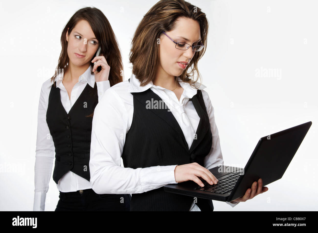 Two girls working Stock Photo - Alamy