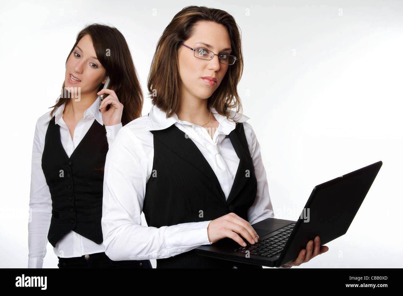Two girls working Stock Photo - Alamy