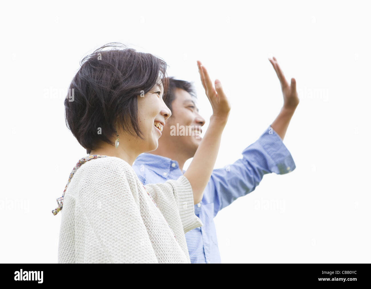 Couple waving hands Stock Photo - Alamy