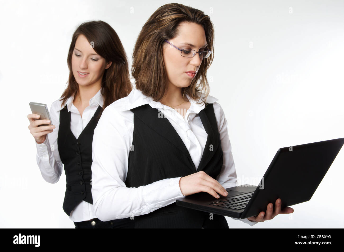 Two girls at work Stock Photo - Alamy