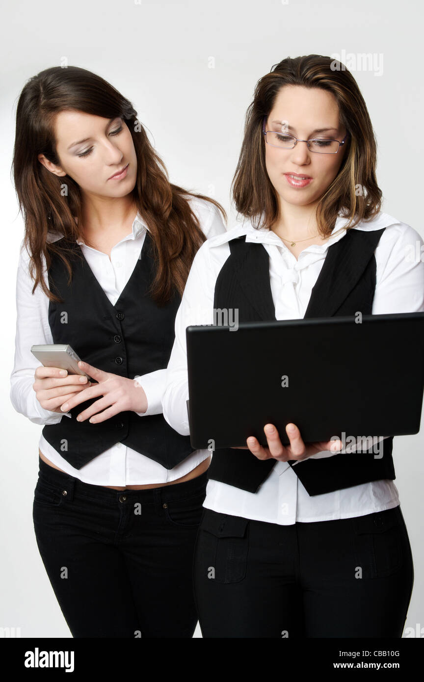 Two girls at work Stock Photo - Alamy