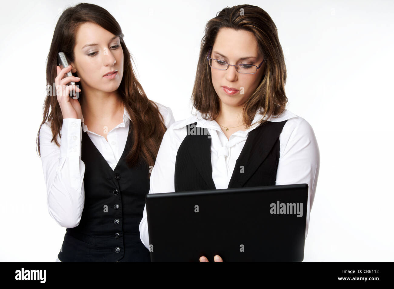 Two girls at work Stock Photo - Alamy