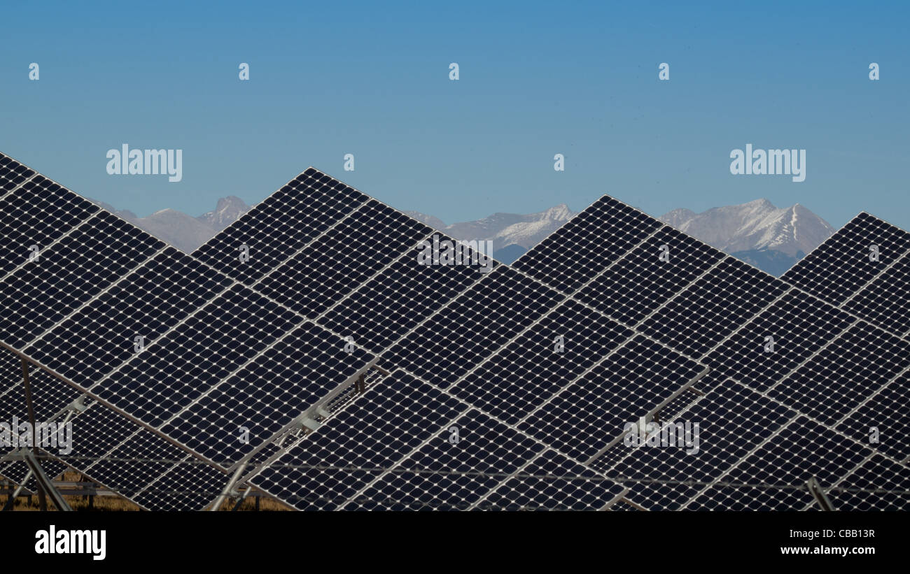 A series of large solar panels forms a symmetrical line at a power ...