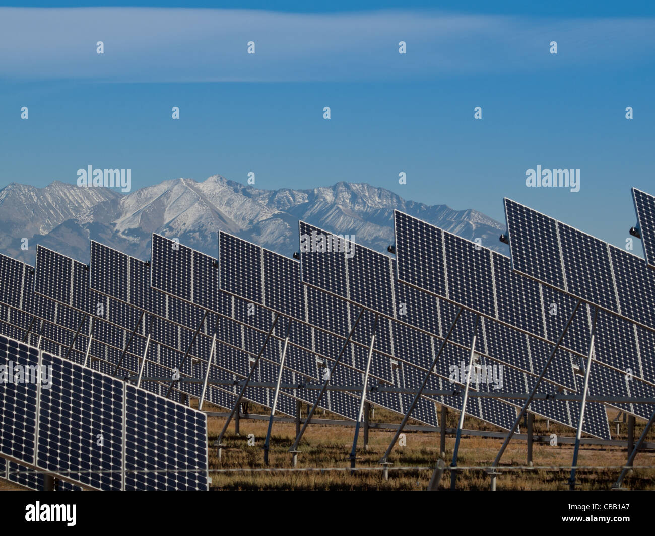 A series of large solar panels forms a symmetrical line at a power ...