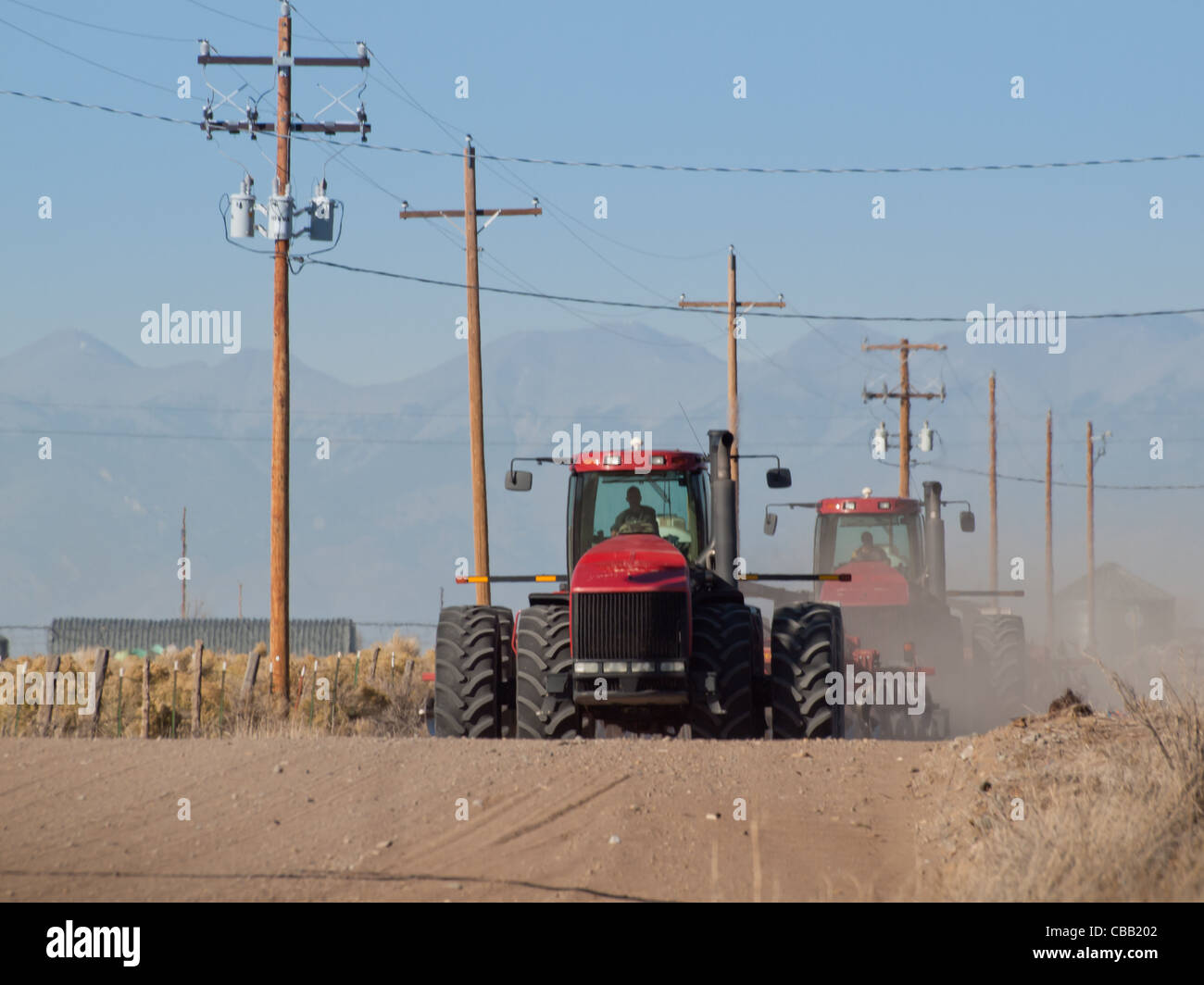 Farm machinery on the rural road in Colorado Stock Photo - Alamy