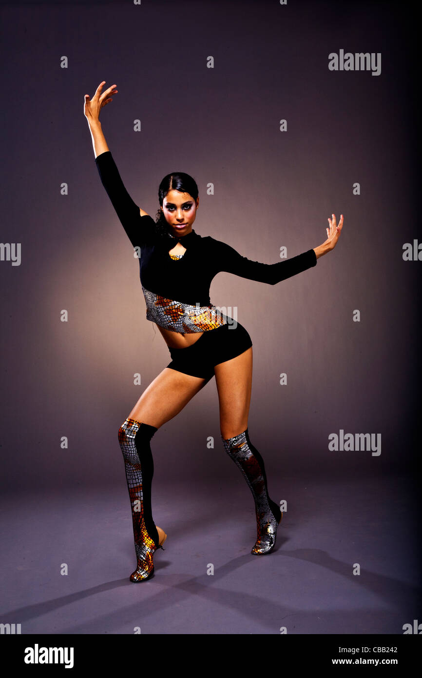 Female dancer wearing black with multi colors Stock Photo - Alamy
