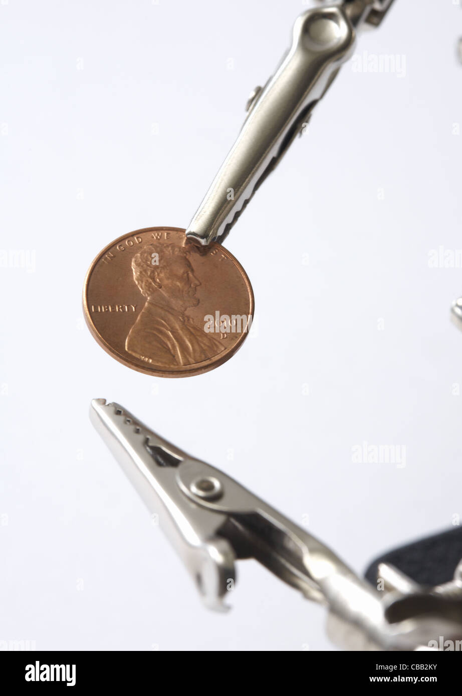 Helping hand holding coin Stock Photo - Alamy