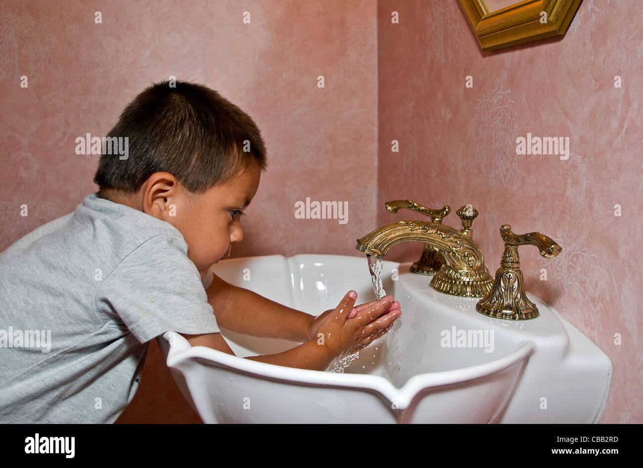 Child washing hands ethnic hi-res stock photography and images - Alamy
