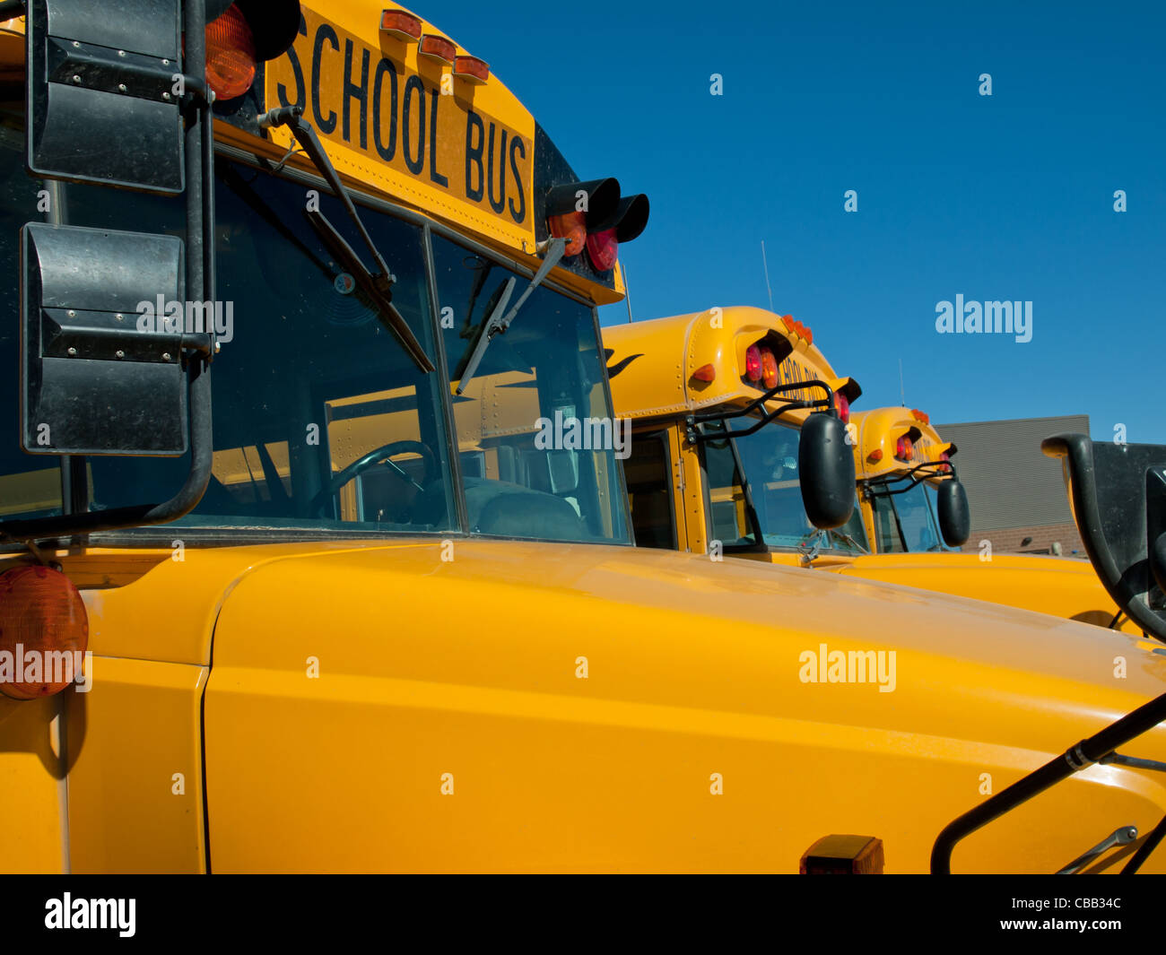 School buses parked near the high school Stock Photo - Alamy