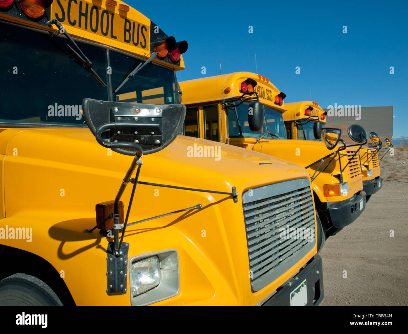 School buses parked near the high school Stock Photo - Alamy