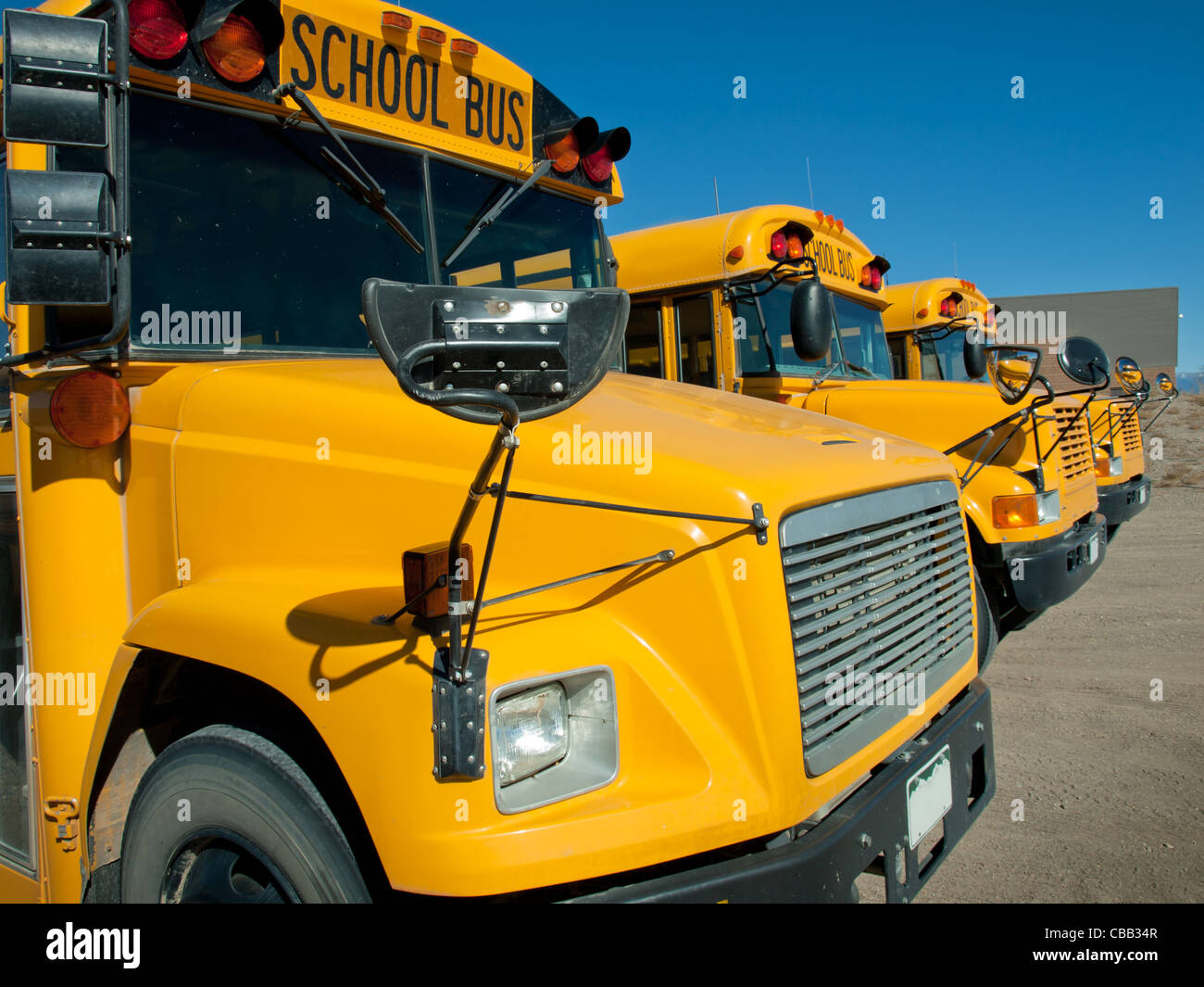School buses parked near the high school Stock Photo - Alamy