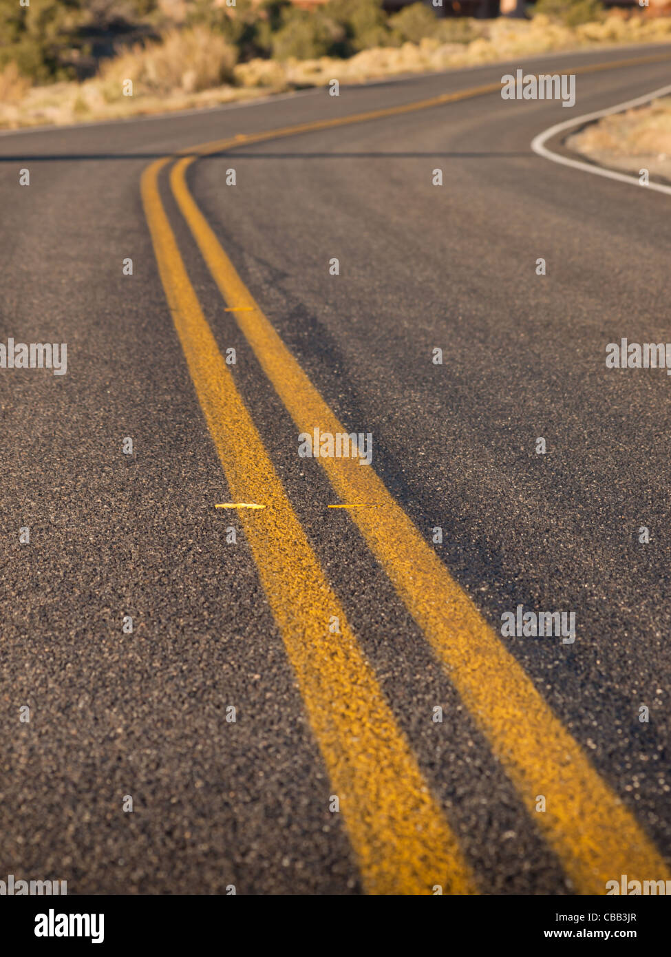Rural paved road with yellow line Stock Photo - Alamy