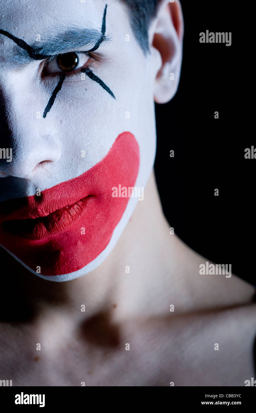 Male model with clown makeup on, cropped portrait photographed in a ...