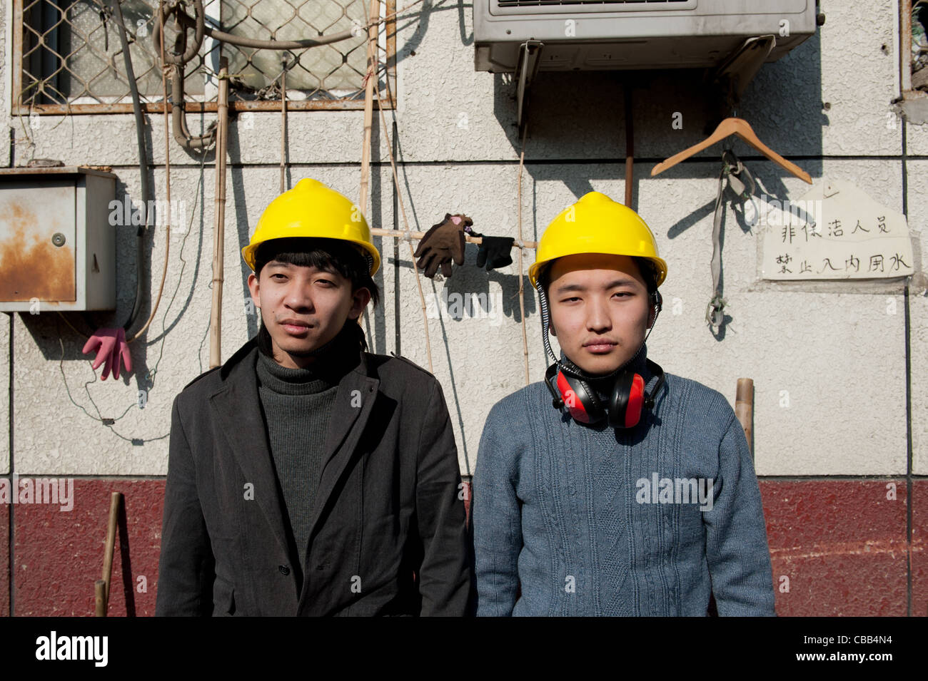 Construction workers standing on a street in an industrial area Stock ...