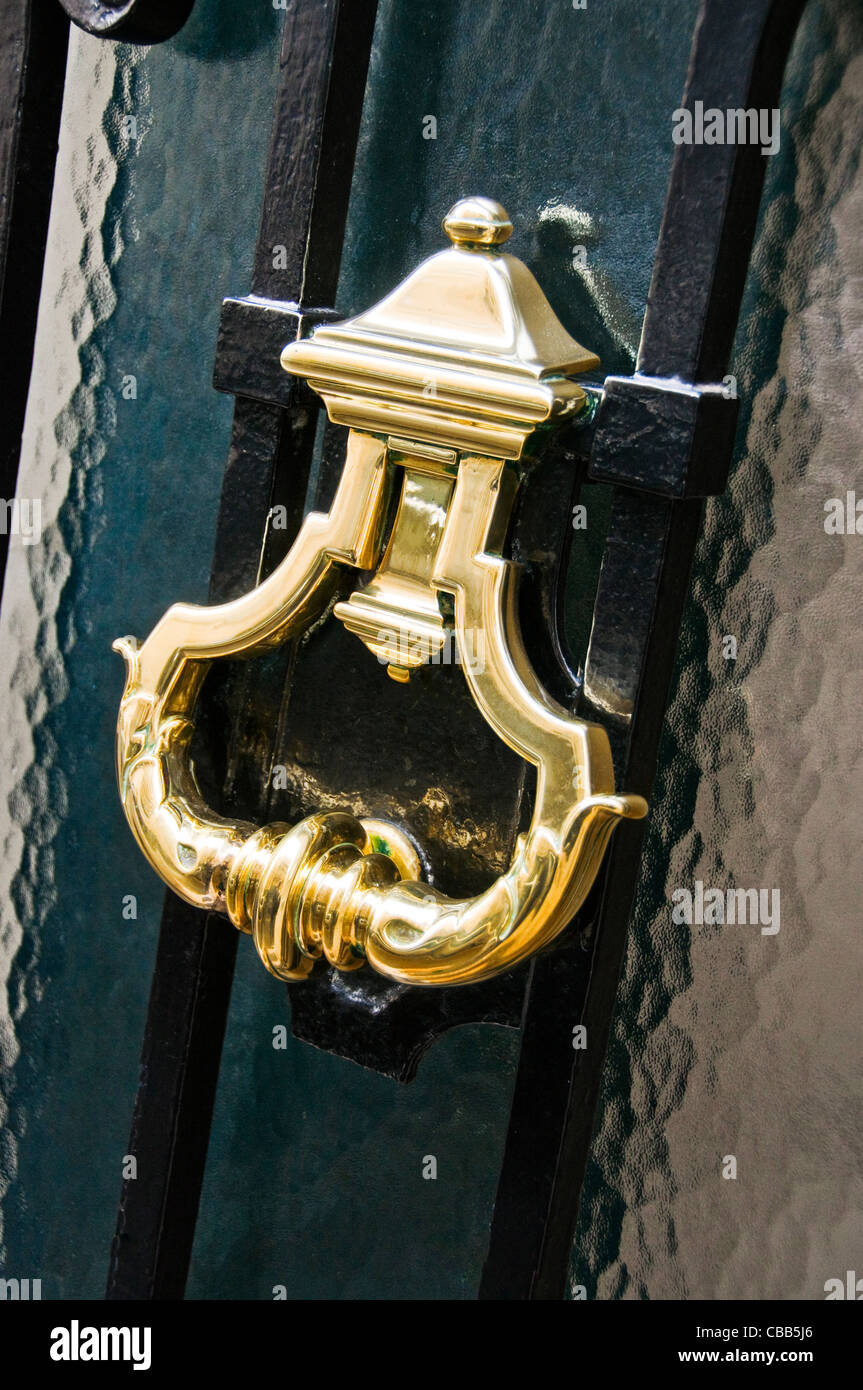 Ornamental brass gold door knocker Stock Photo - Alamy