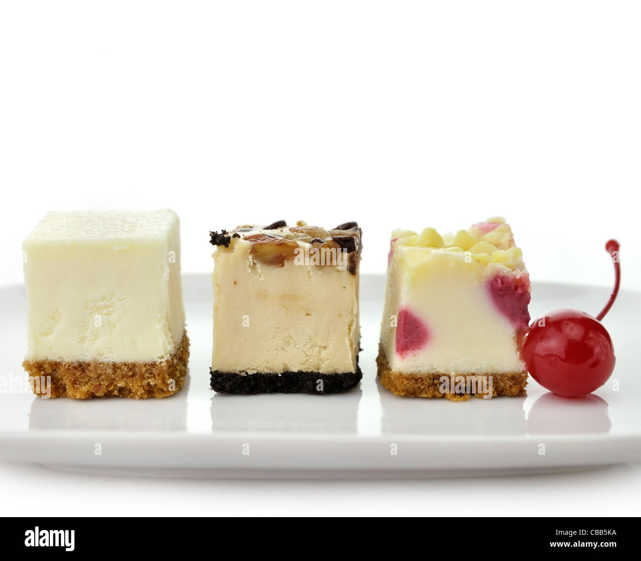 Variation of Mini Cheesecake Slices In A Dish Stock Photo - Alamy