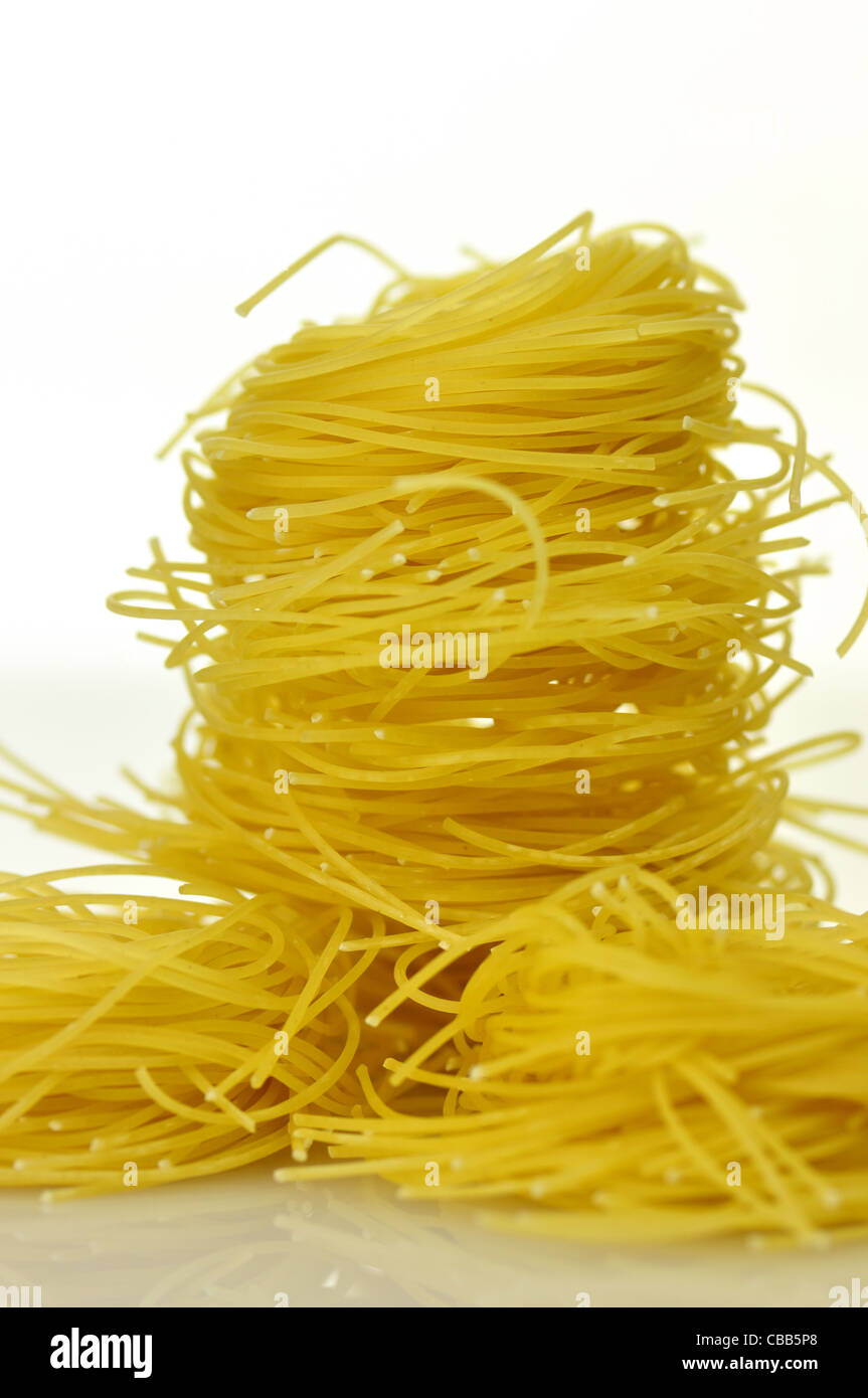 pasta nests on white background , close up Stock Photo - Alamy